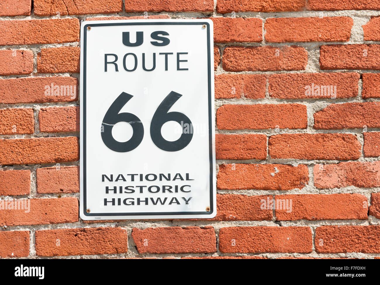 US Route 66 National Historic Highway sign on red brick wall, Galena ...