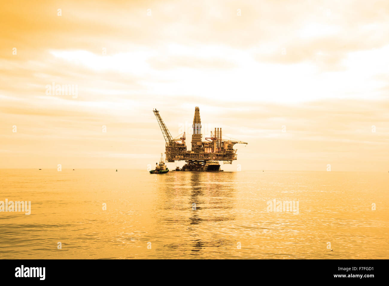 Oil Rig during sunset hours Stock Photo - Alamy