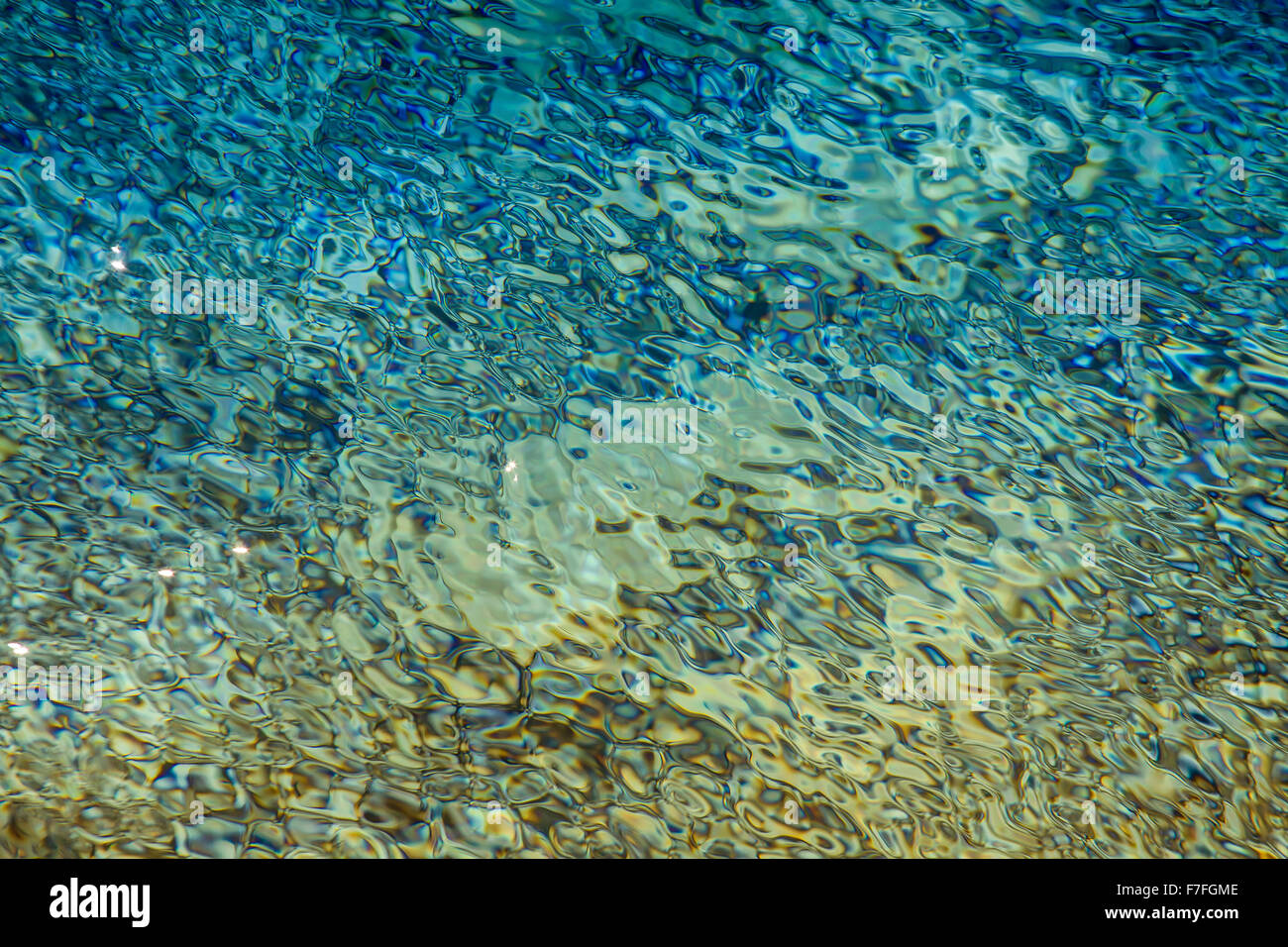 Background of bright blue and yellow water Stock Photo - Alamy