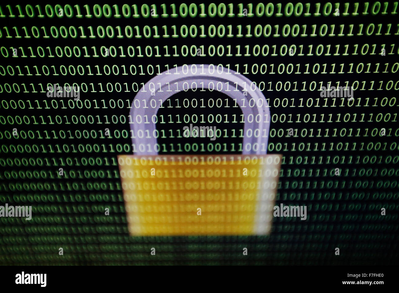 A lock is pictured on a computer screen with binary type Stock Photo ...