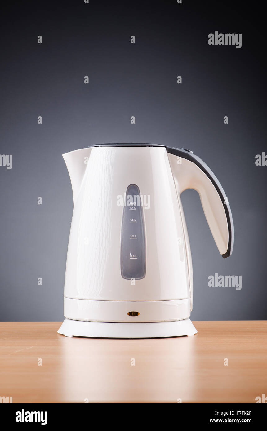 White kettle against grey background Stock Photo - Alamy