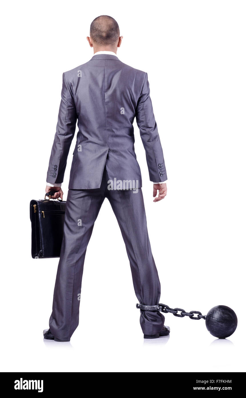 Businessman with shackles on white Stock Photo - Alamy
