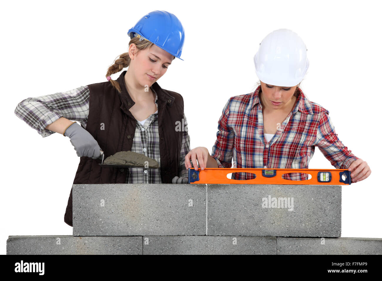 Two female bricklayers Stock Photo - Alamy