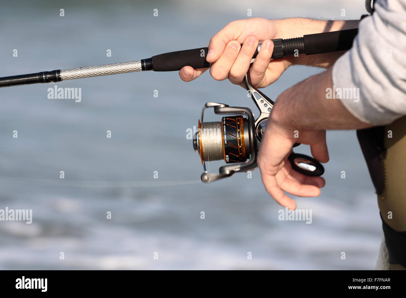hands of a fisherman collecting line Stock Photo - Alamy