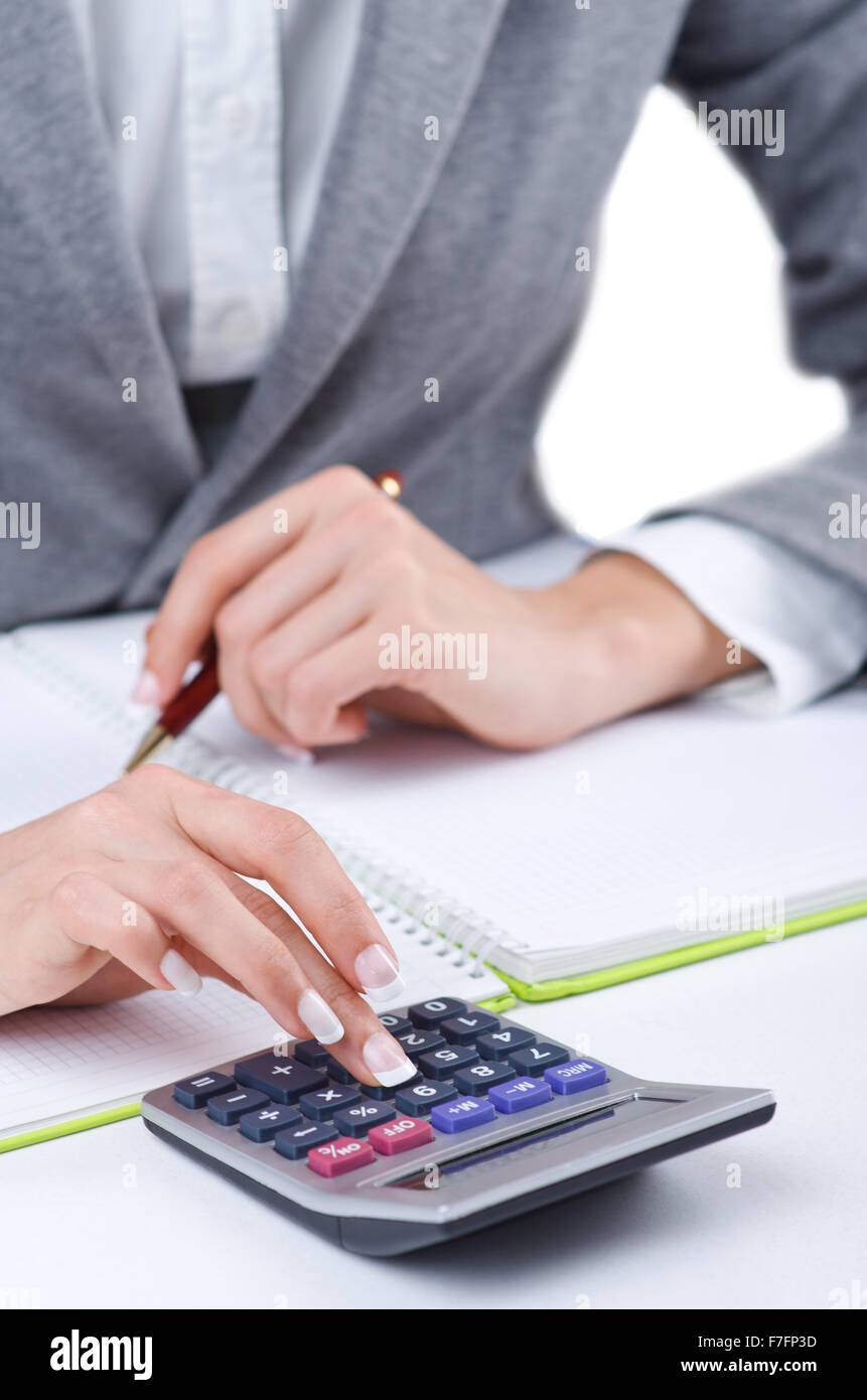 Hands working on the calculator Stock Photo - Alamy