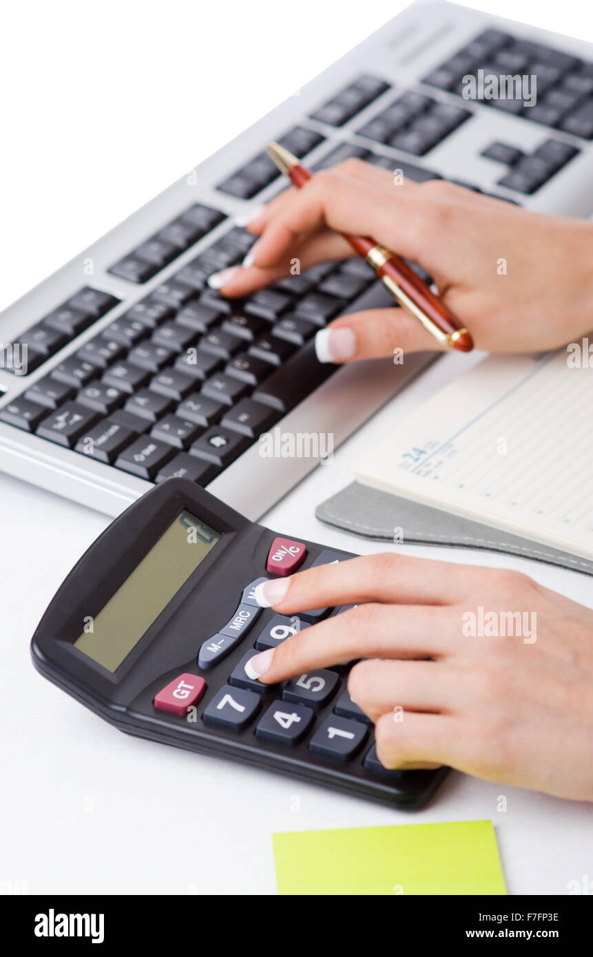 Hands working on the calculator Stock Photo - Alamy