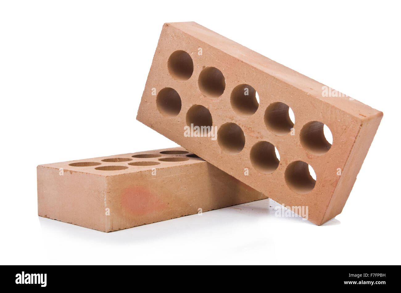Stack of clay bricks isolated on white Stock Photo - Alamy