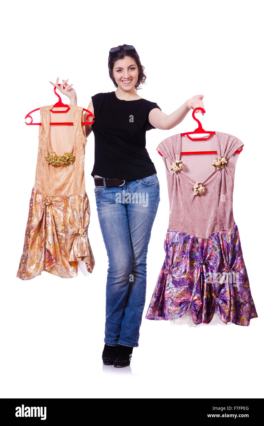 Woman trying to choose dress on white Stock Photo - Alamy