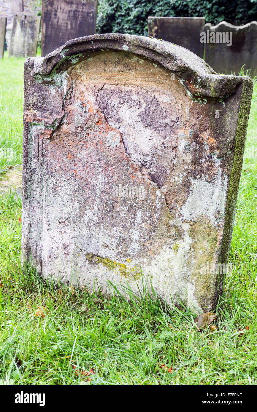 Ancient, worn gravestone with name worn off Stock Photo - Alamy