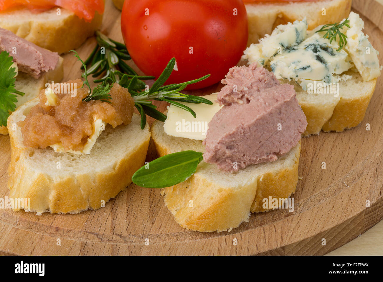 Assorted tapas with fish, blue cheese, caviar and liver Stock Photo - Alamy