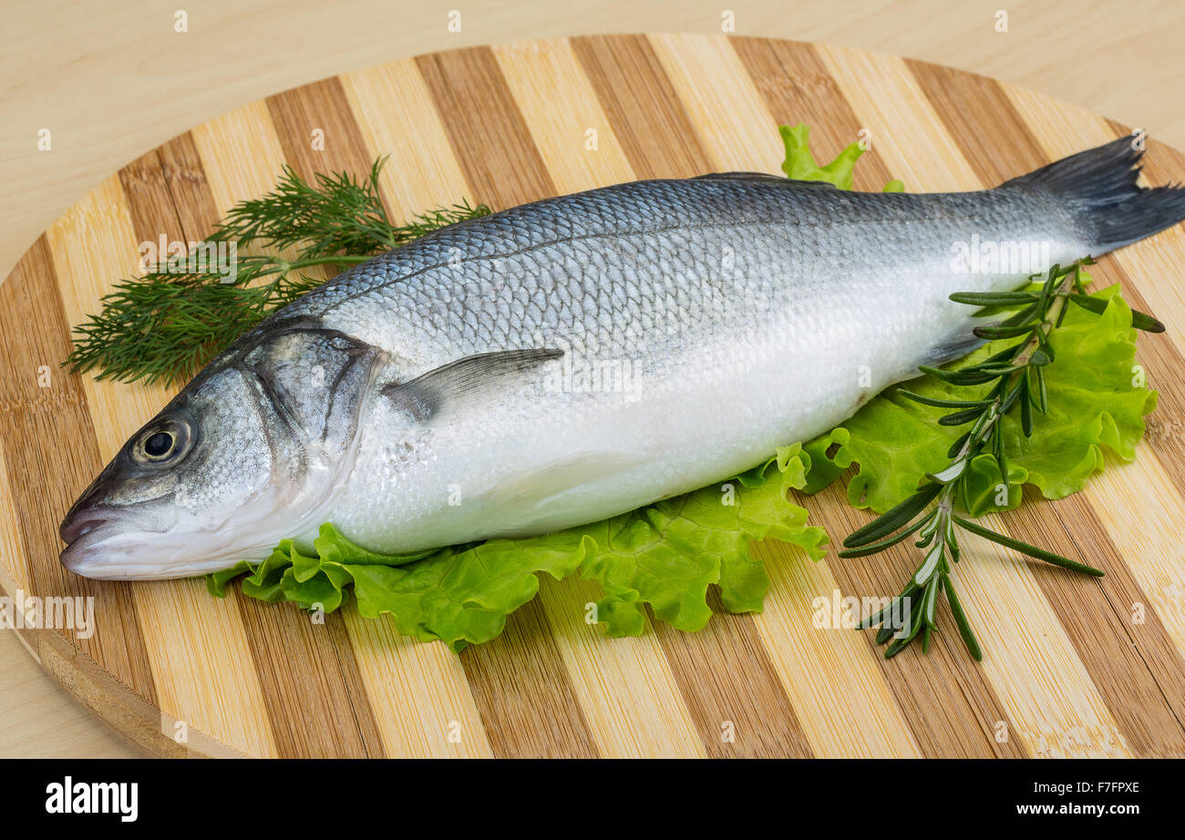 Raw seabass fish with rosemary and dill Stock Photo - Alamy