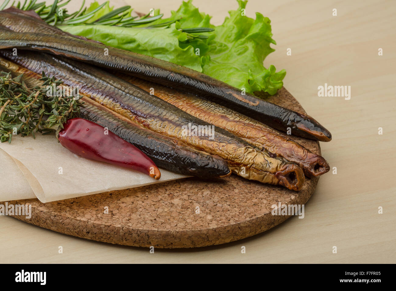 Smoked Lamprey - seafood delicacy with salad and herbs Stock Photo - Alamy