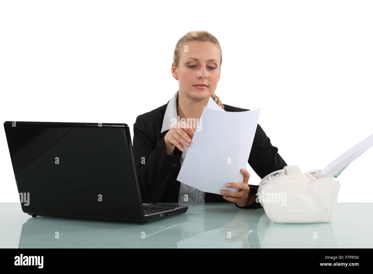 Clerical worker flipping through a document Stock Photo - Alamy