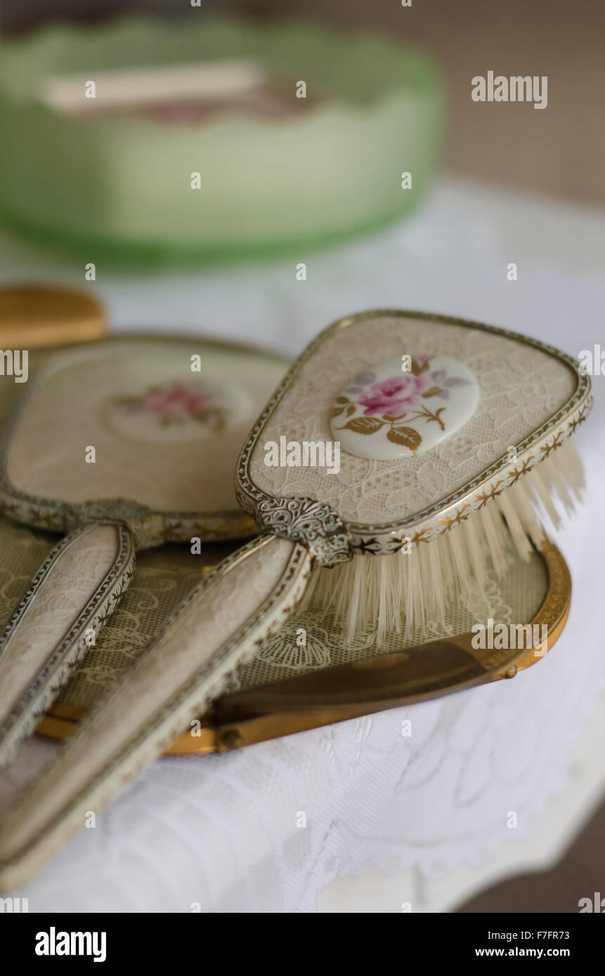 Old fashioned floral dressing table mirror and brush Stock Photo - Alamy