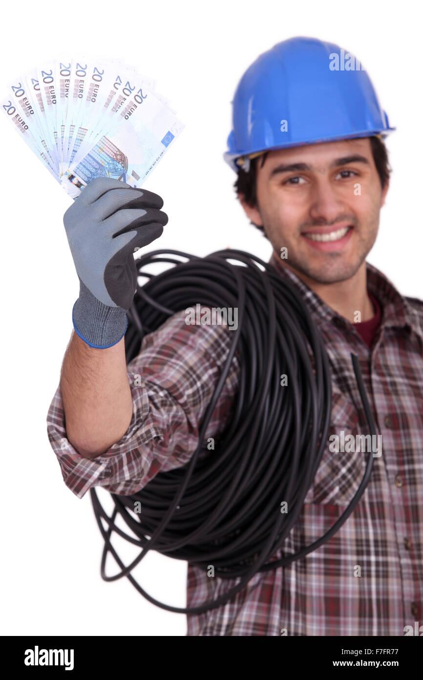craftsman holding money Stock Photo - Alamy