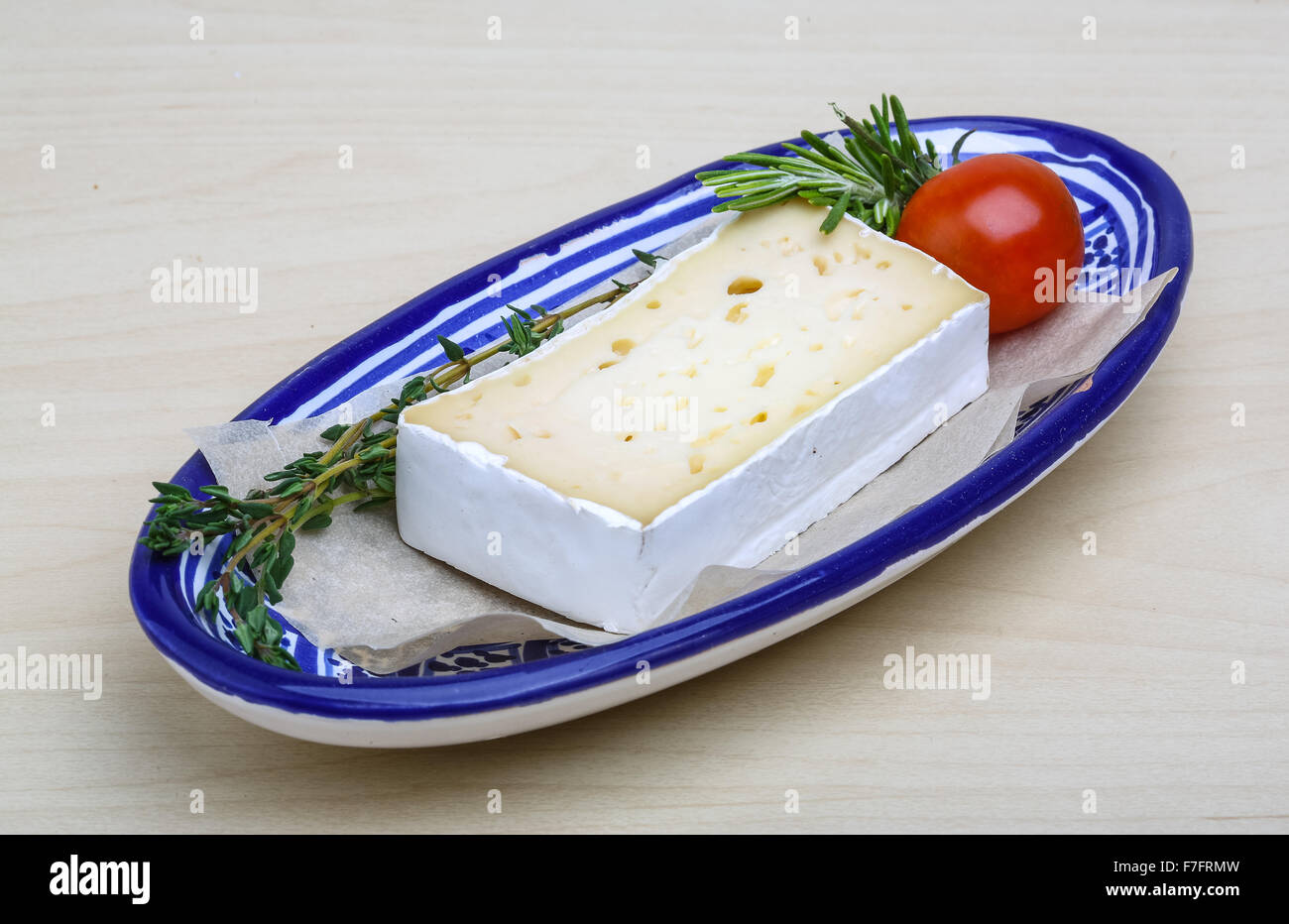 Soft brie cheese with rosemary, thyme and toast bread Stock Photo - Alamy