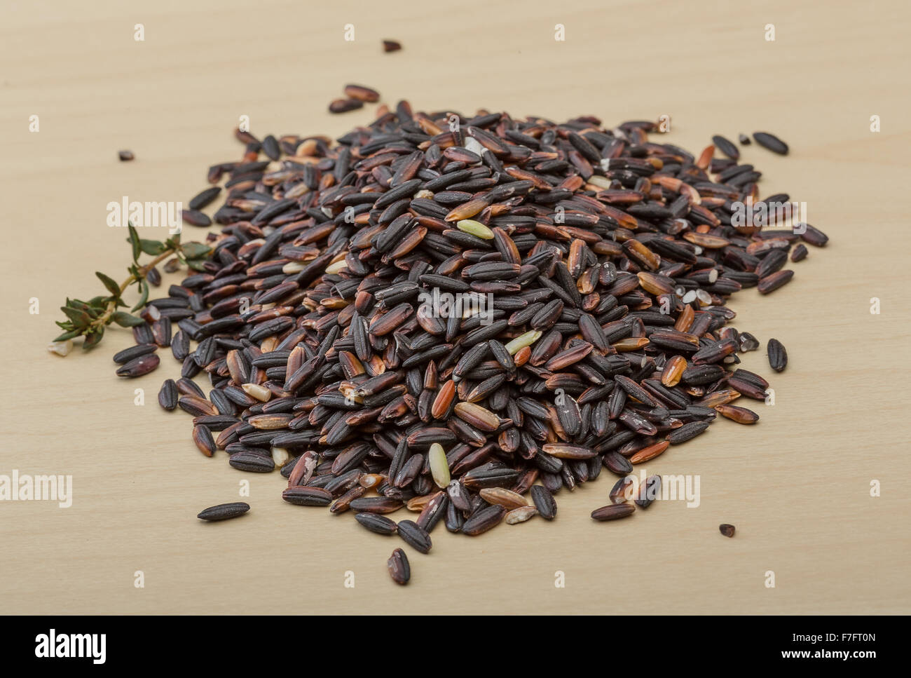 Dry wild rice mix heap on the wood background Stock Photo - Alamy