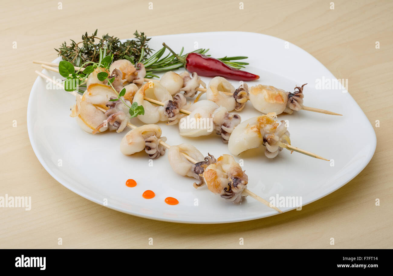 Grilled cuttlefish bbq with rosemary and pepper Stock Photo - Alamy