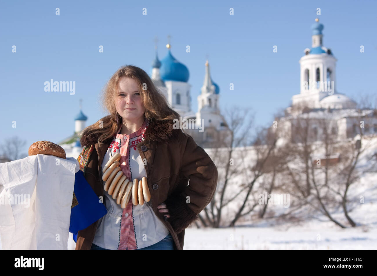 girl in russian traditional clothes against Orthodox monastery in ...