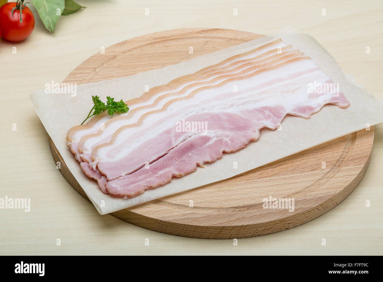 Raw Bacon strips on the wood background Stock Photo - Alamy