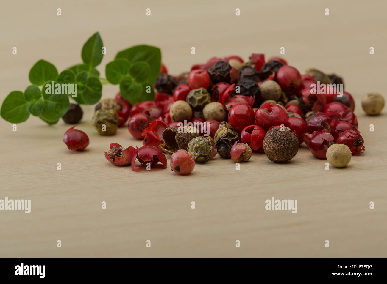 Red, white and black pepper mix heap Stock Photo - Alamy