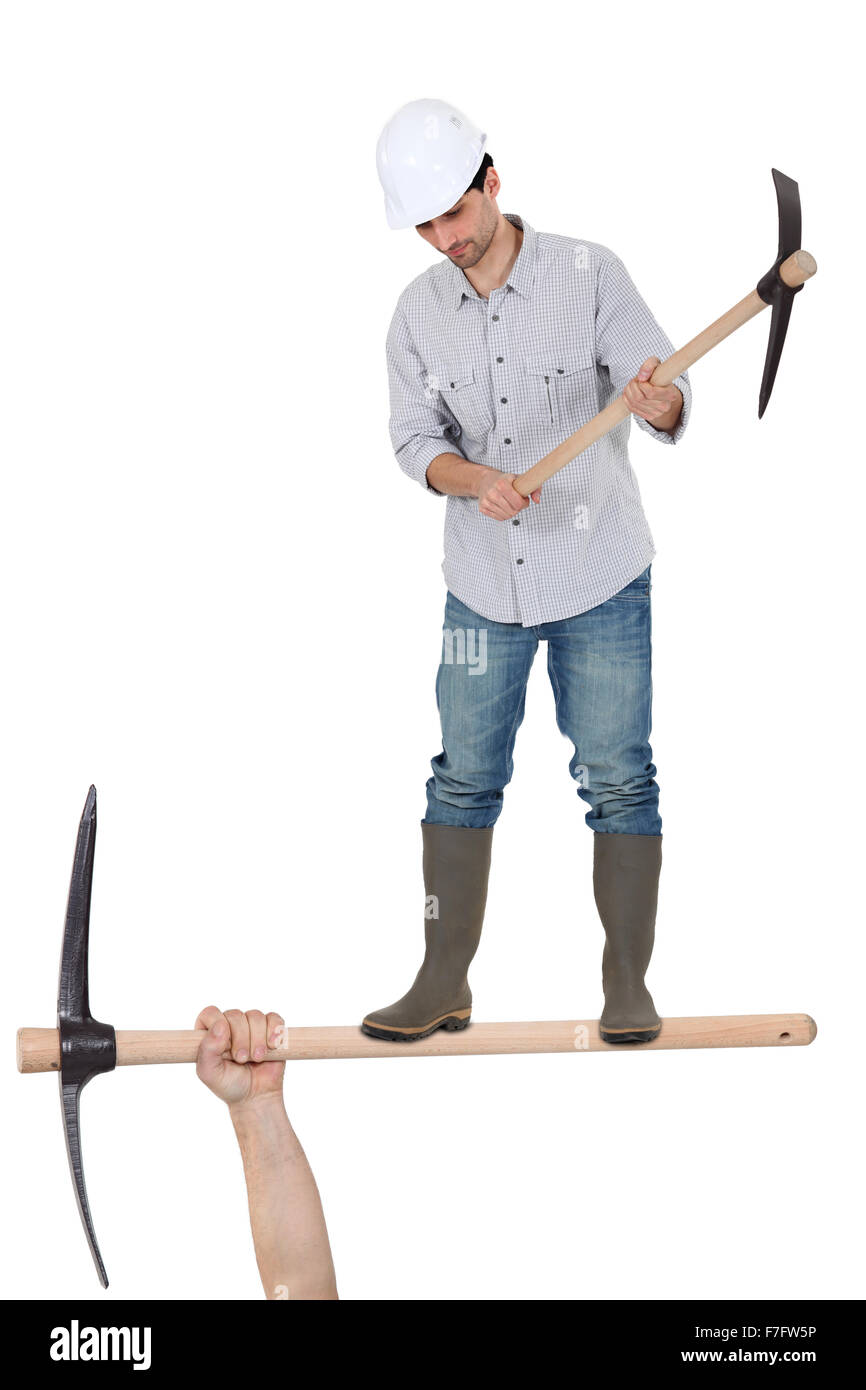 Man with a pickaxe Stock Photo - Alamy