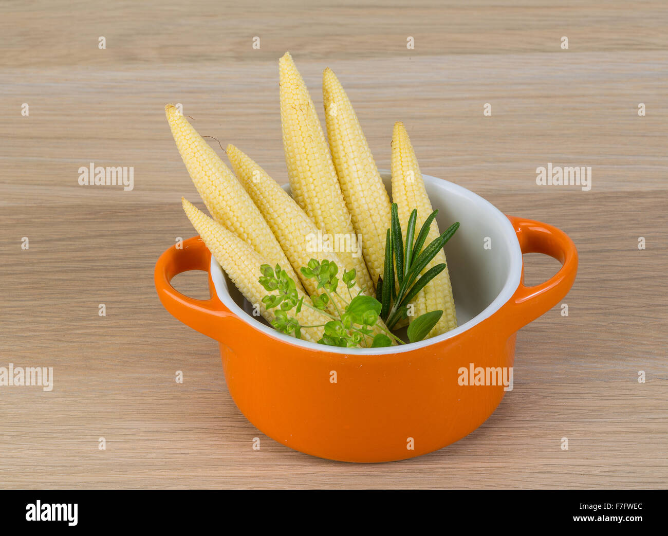 Fresh ripe Baby corn on the wood background Stock Photo - Alamy