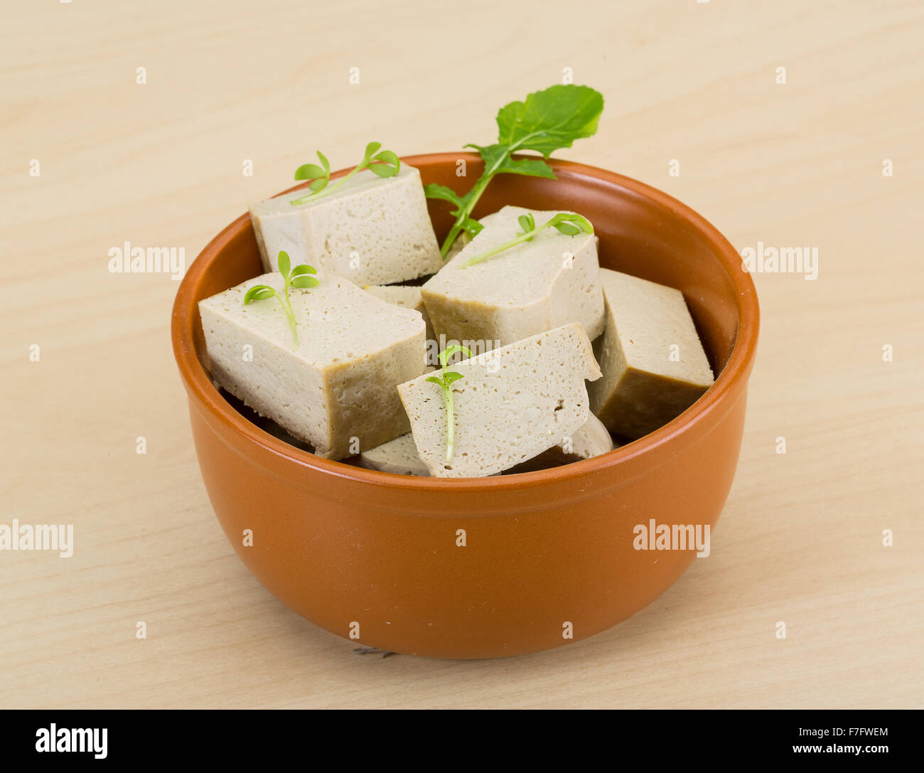 Tofu - soya cheese with herbs on the wood background Stock Photo - Alamy