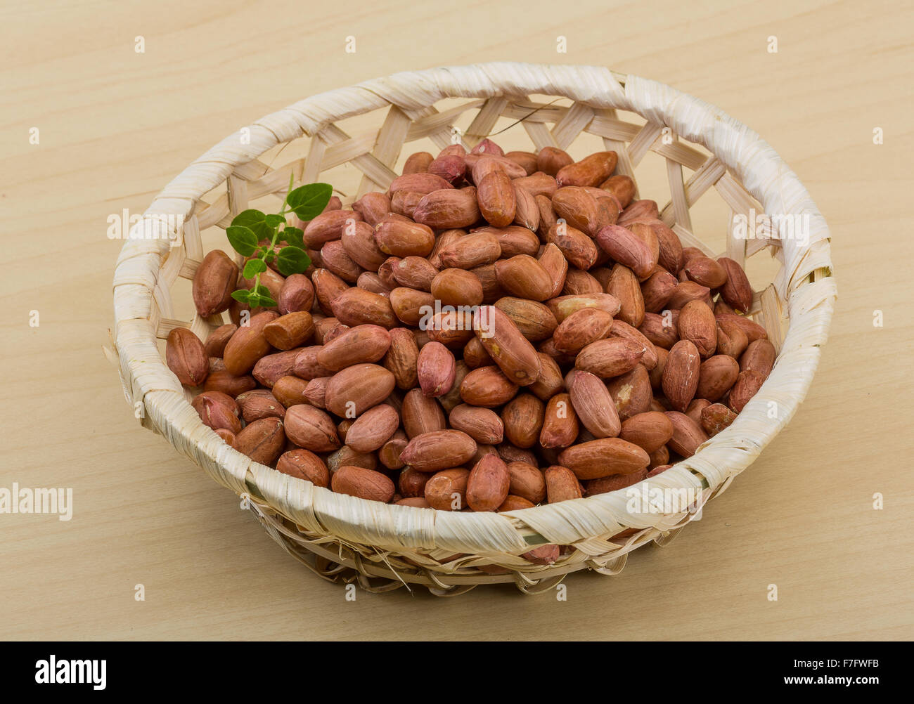 Raw Peanut in the bowl on wood background Stock Photo - Alamy