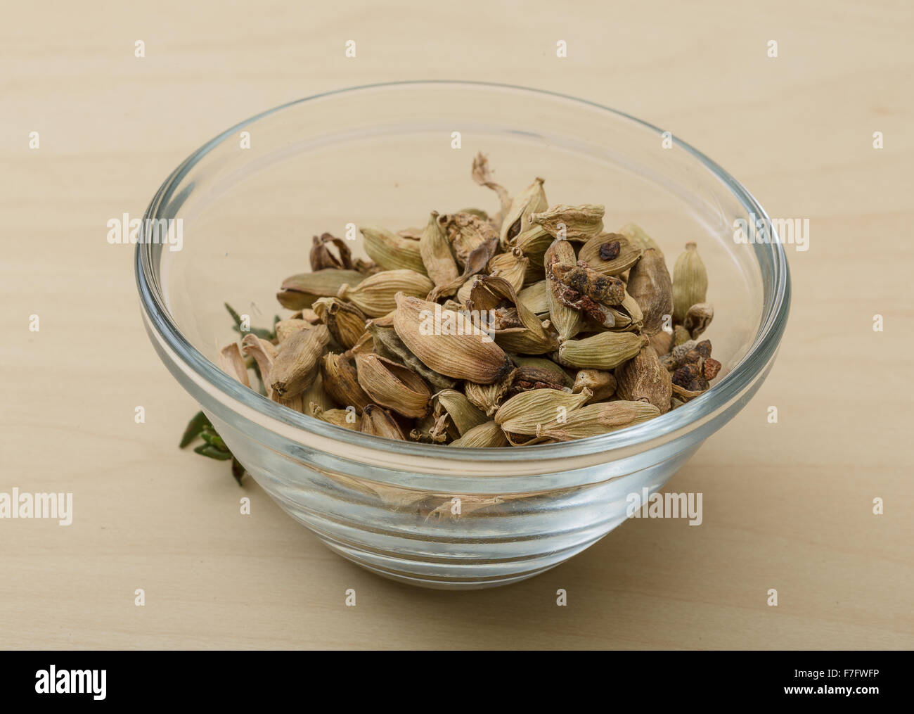 Dry Cardamom heap on the wood background Stock Photo - Alamy