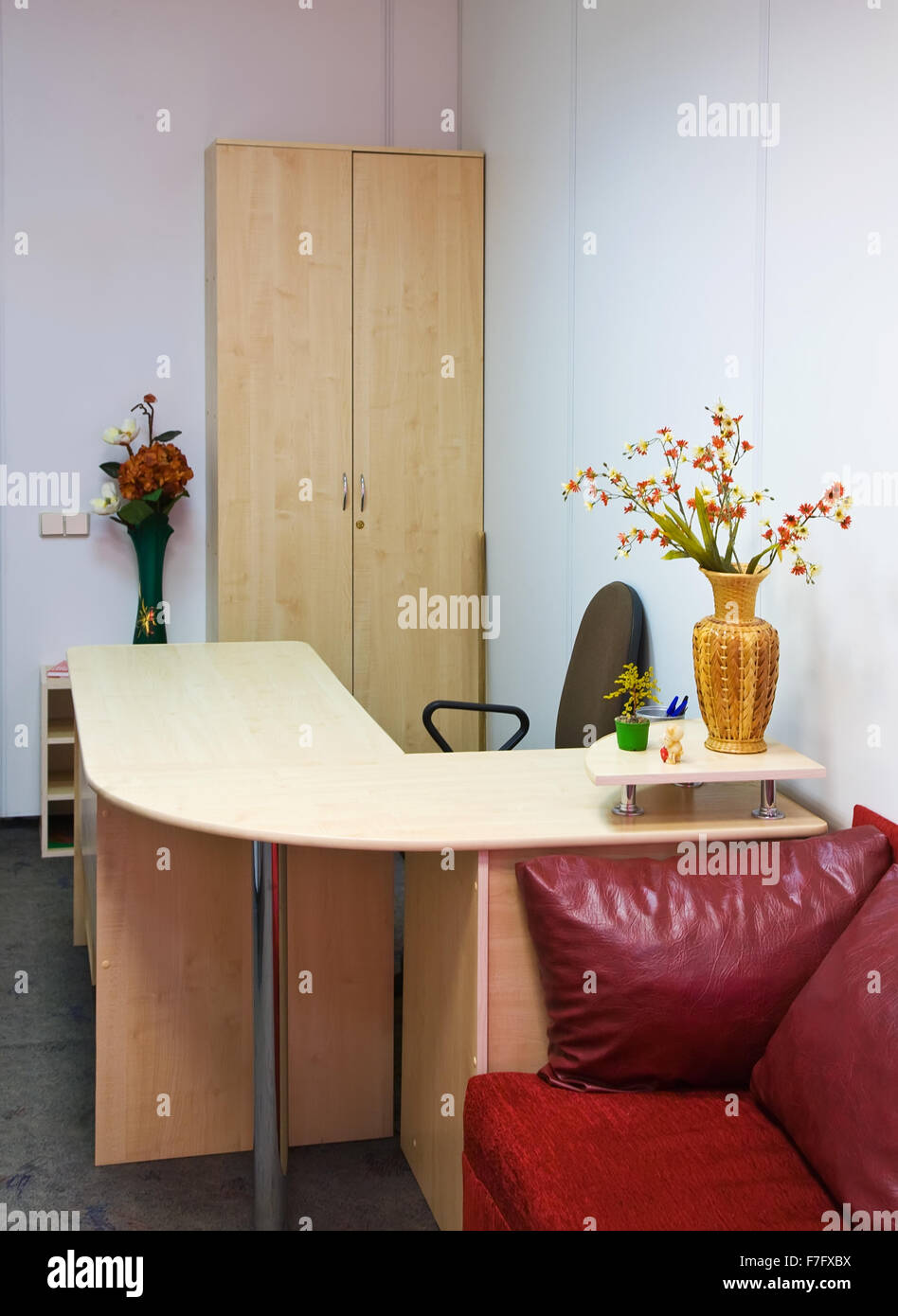 interior of office room with red sofa Stock Photo - Alamy