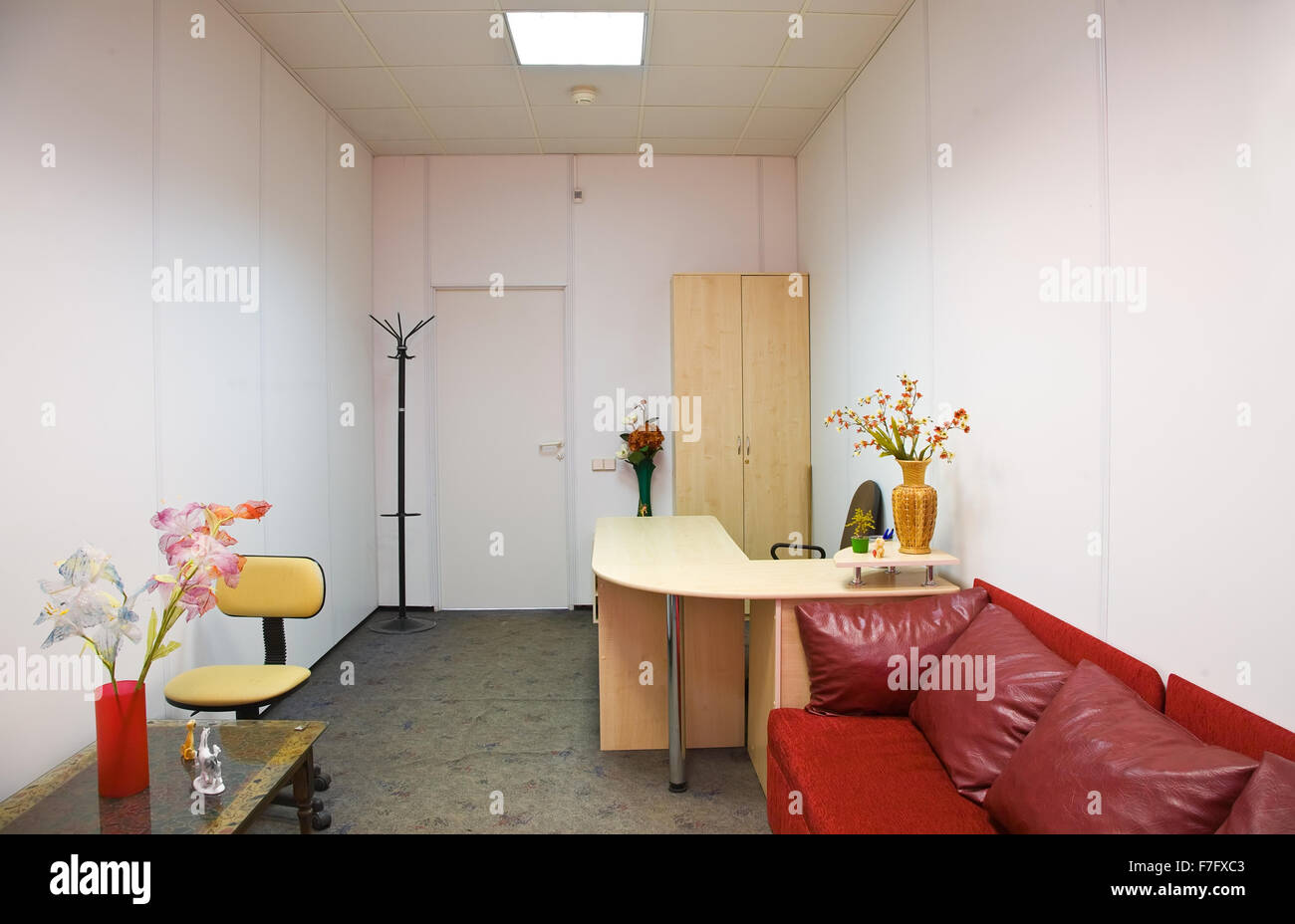interior of office room with red sofa Stock Photo - Alamy