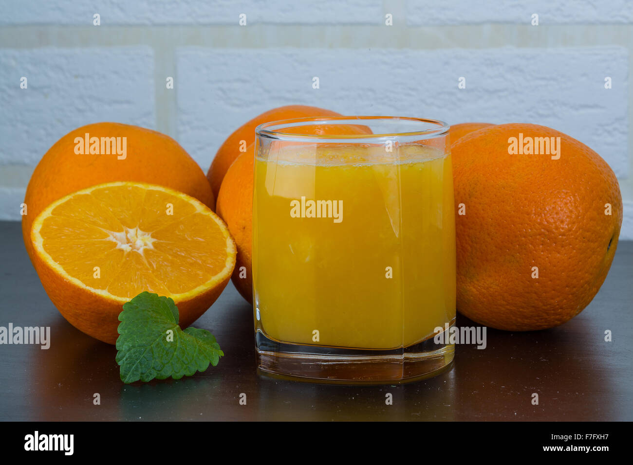 Fresh made Orange juice with ripe fruits Stock Photo - Alamy