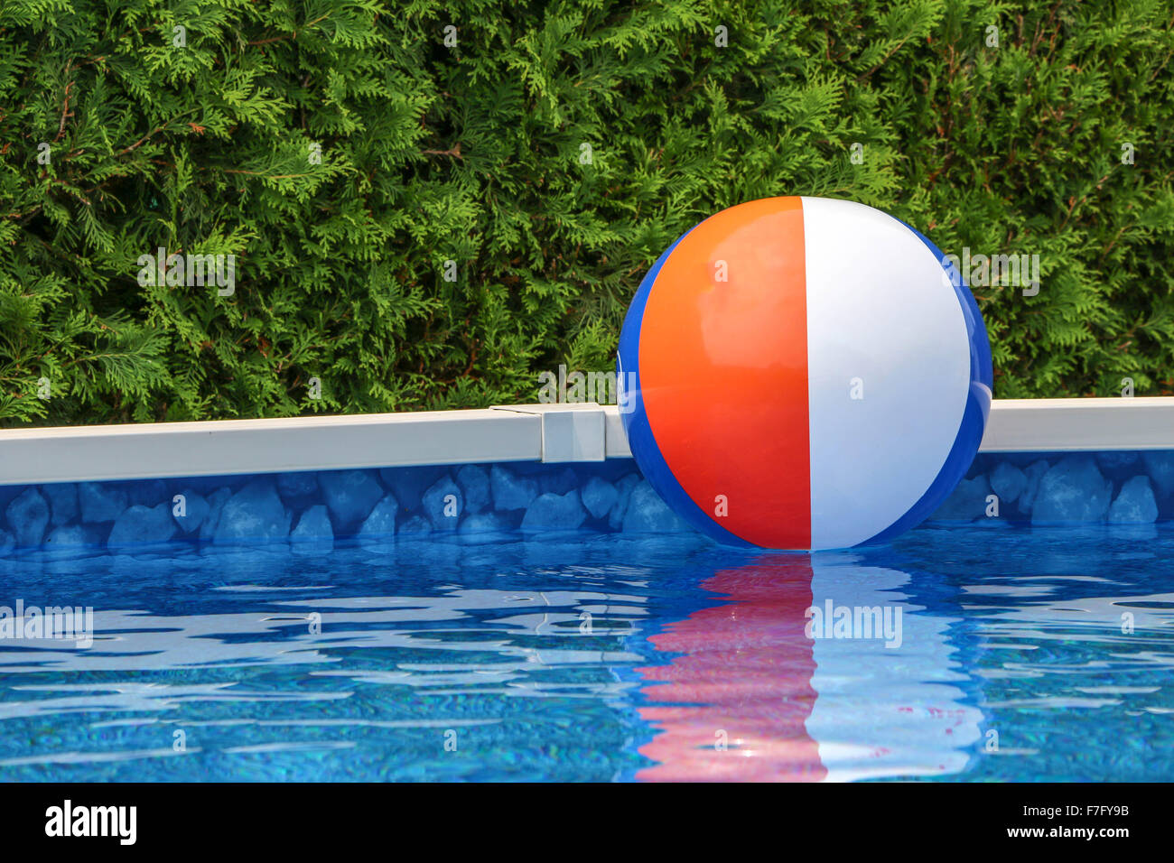 Inflatable ball on water in swimming pool Stock Photo - Alamy