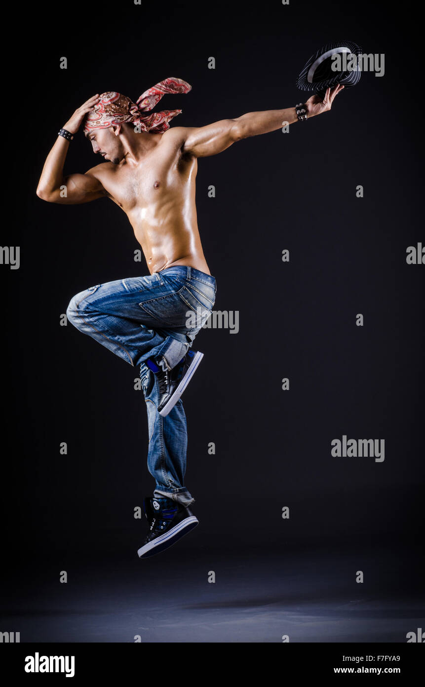Dancer dancing in the dark studio Stock Photo - Alamy