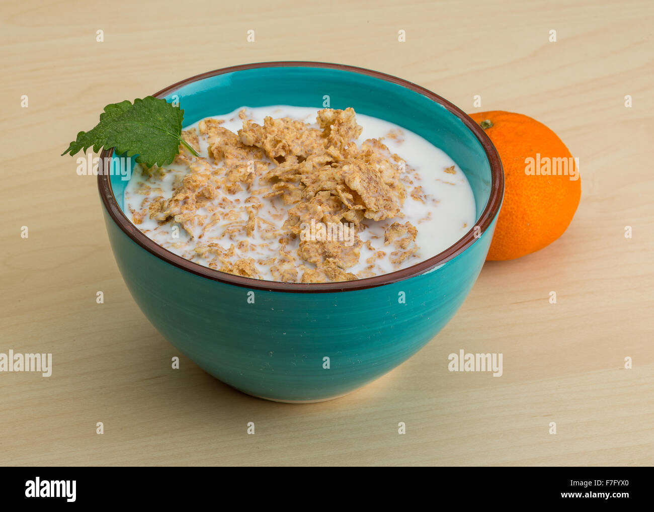 Cornflakes with tangerine and fresh mint leaves Stock Photo - Alamy
