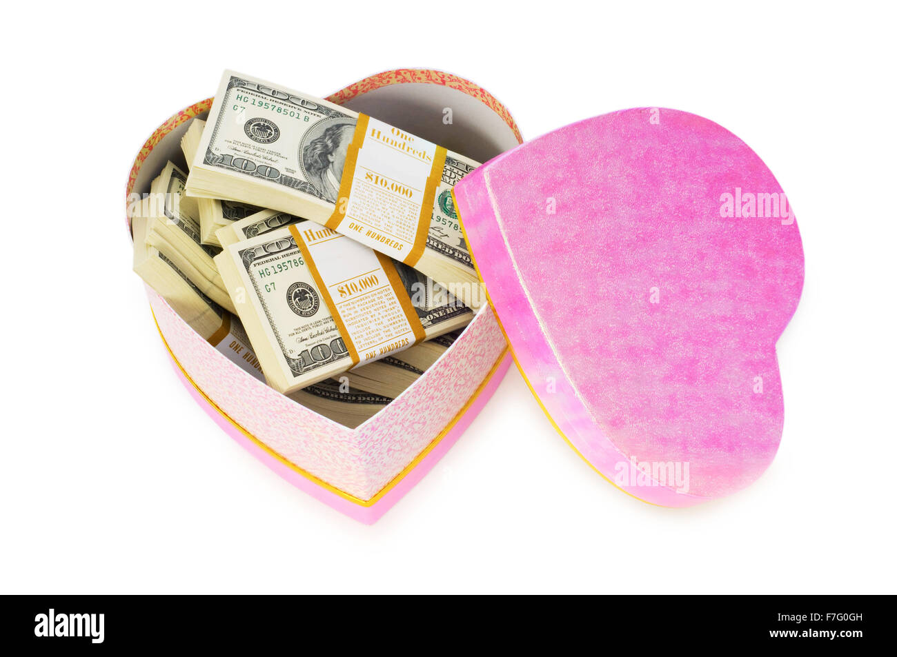 Heart shaped gift box and dollars inside Stock Photo - Alamy