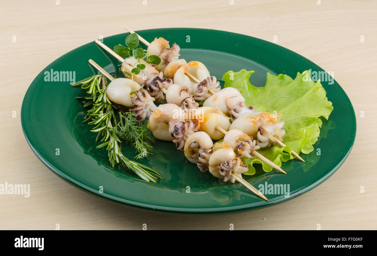Grilled cuttlefish bbq with rosemary and pepper Stock Photo - Alamy