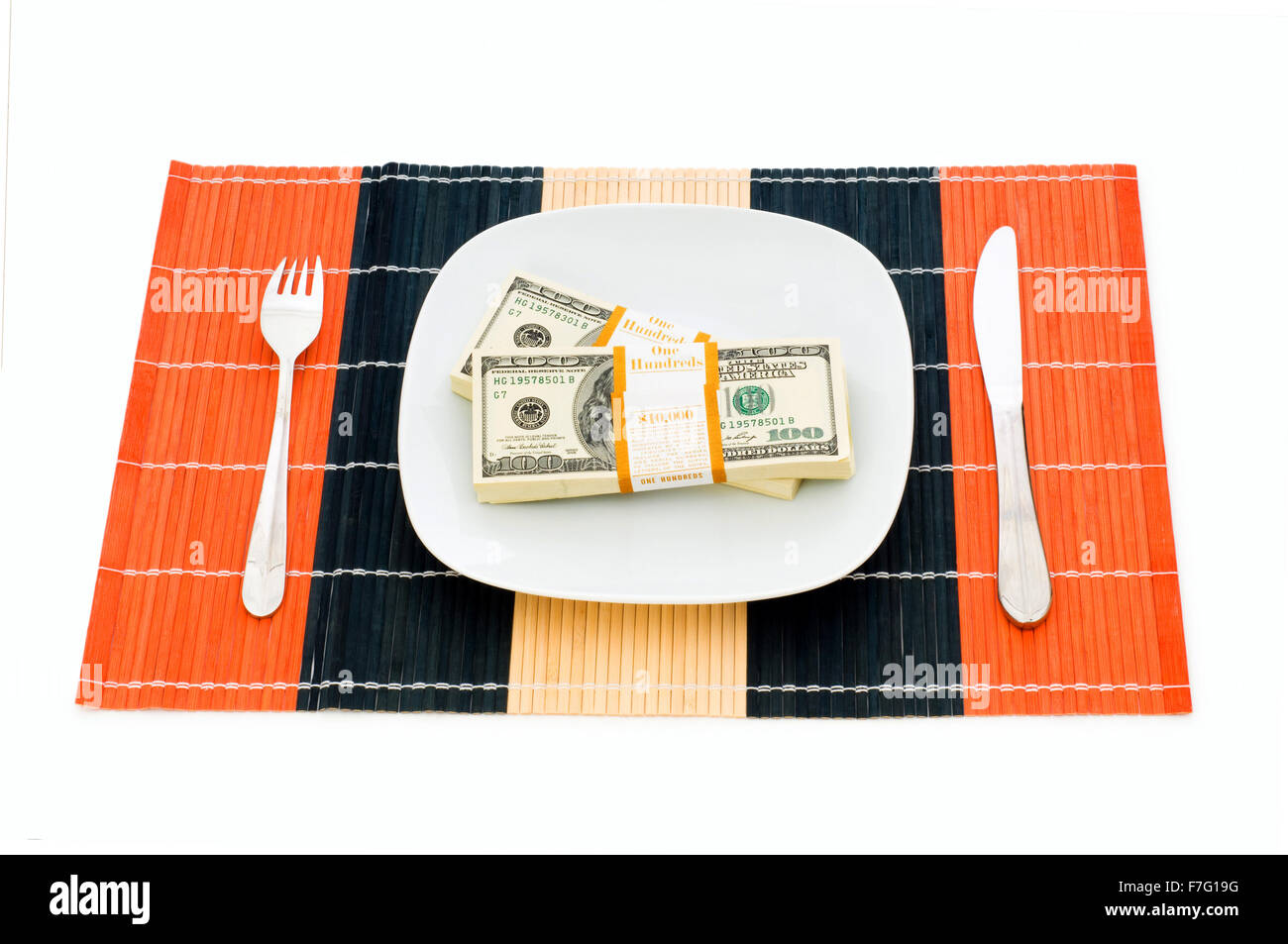 Financial concept - eating money isolated on white Stock Photo - Alamy