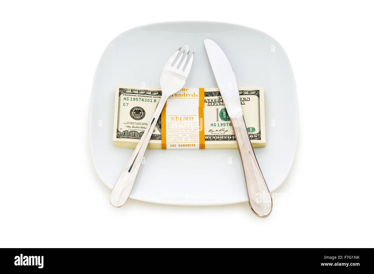 Financial concept - eating money isolated on white Stock Photo - Alamy