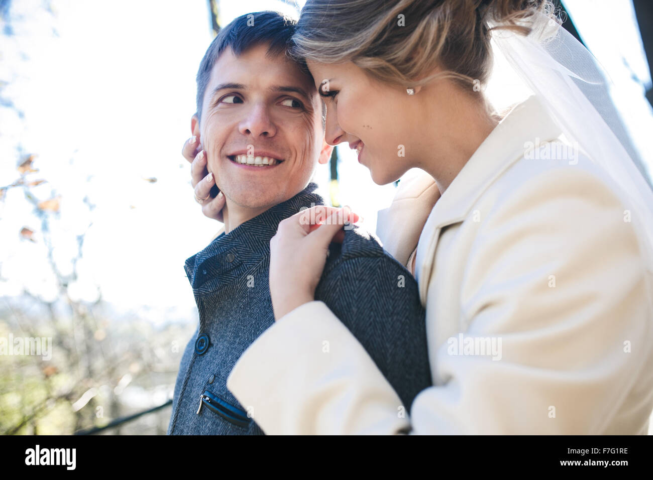 Bride hugs groom Stock Photo - Alamy