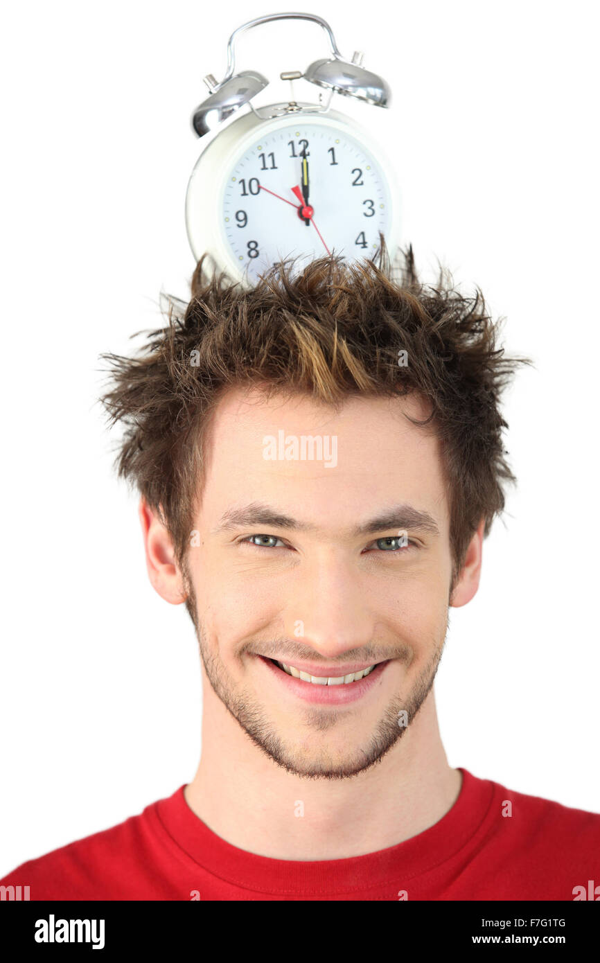 Man with alarm clock on his head Stock Photo - Alamy