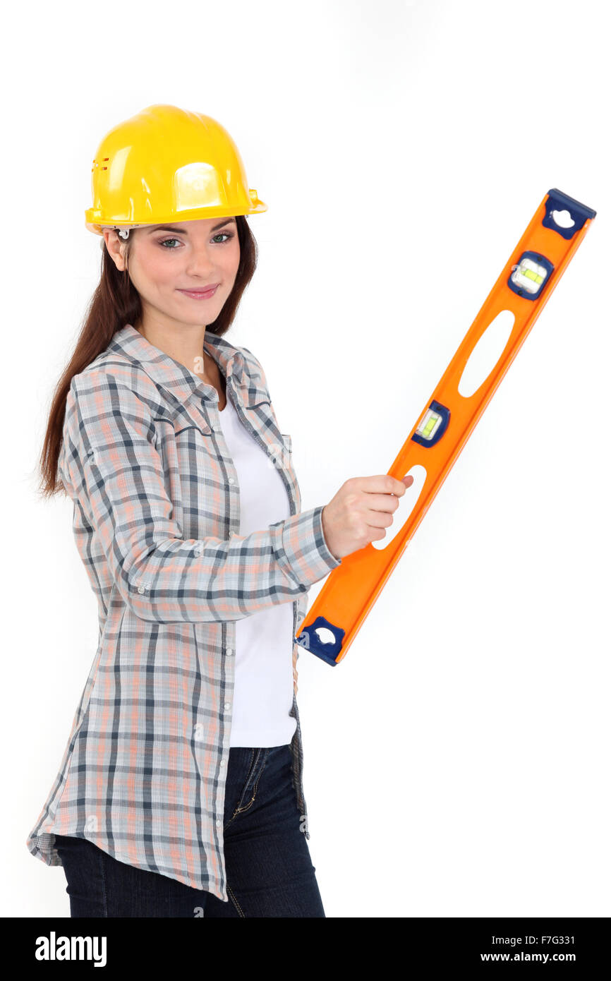 Woman with a spirit level Stock Photo - Alamy
