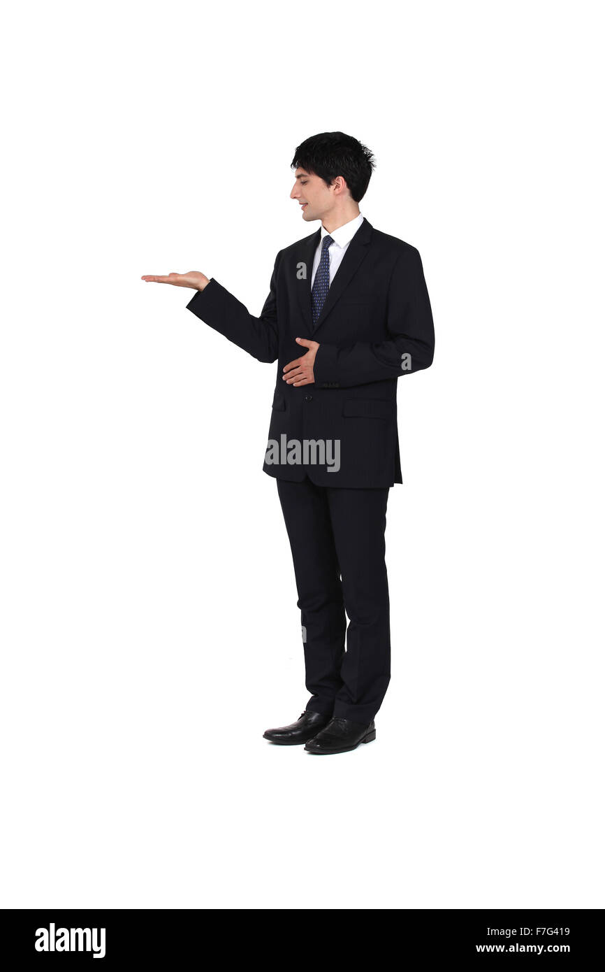 Man wearing a suit and presenting his right hand Stock Photo - Alamy