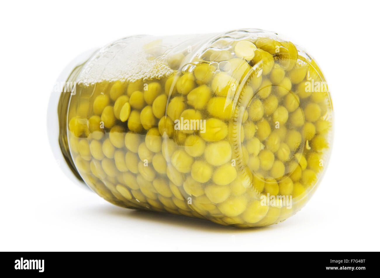 Green peas in glass jar isolated on white Stock Photo - Alamy
