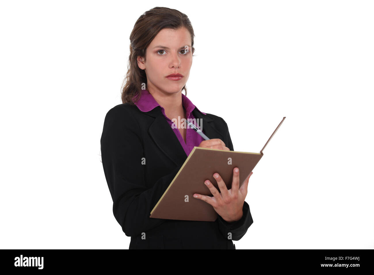 An female executive taking notes Stock Photo - Alamy