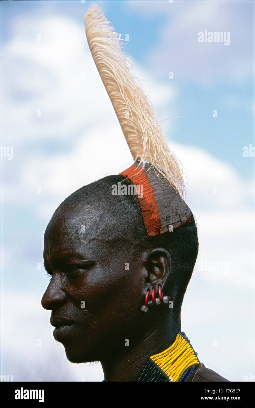 Hamar man with clay hairdo topped by an ostrich plume, in South Omo ...