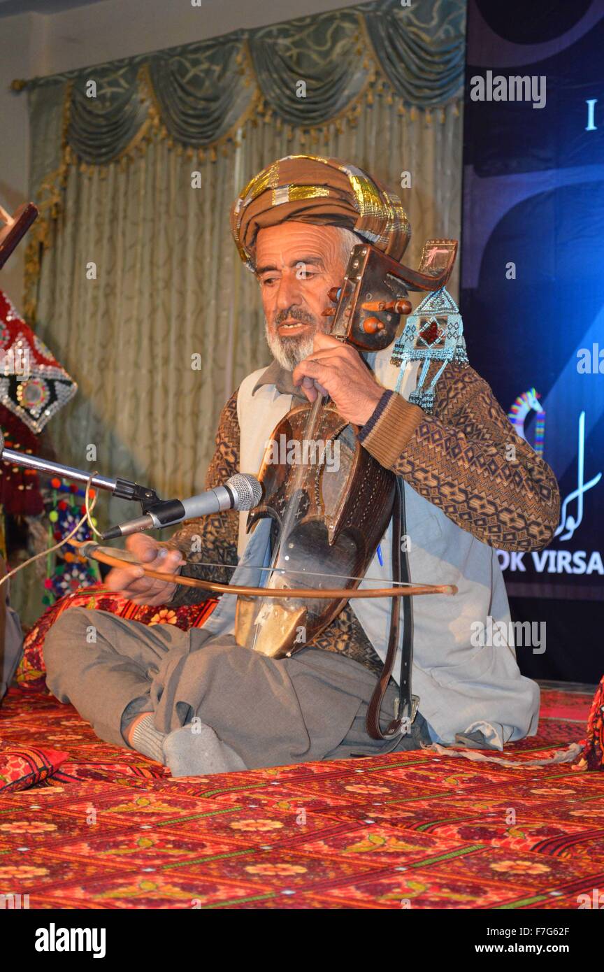 Quetta. 30th Nov, 2015. A man plays traditional musical instrument ...