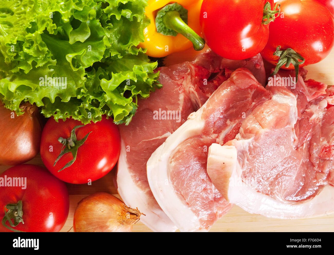 Raw meat and vegetables. Isolated over white Stock Photo - Alamy