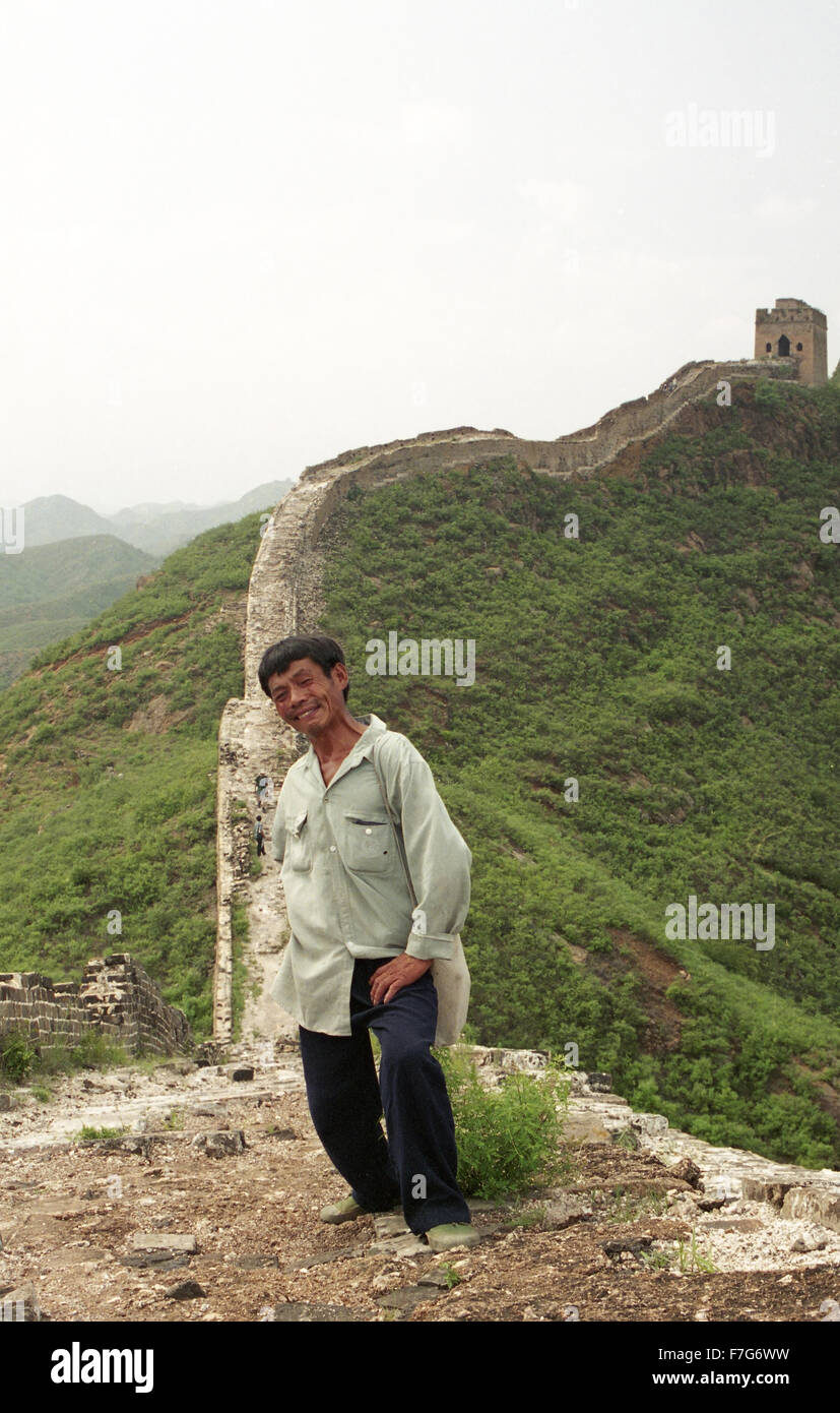 A proud Chinese man who was selling soft drinks poses on the great wall ...